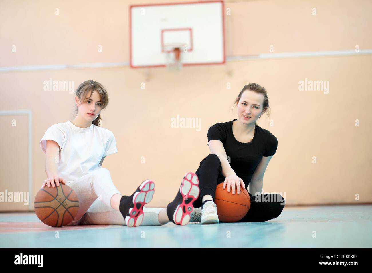 Girl young student in the gym playing a basketball Stock Photo - Alamy