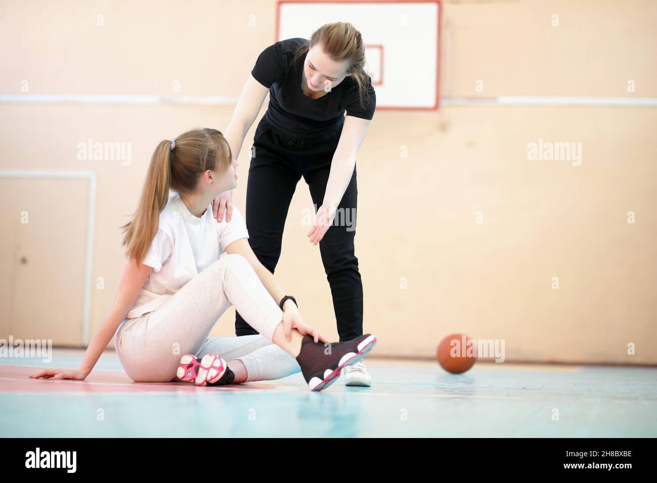 Girl young student in the gym playing a basketball Stock Photo - Alamy