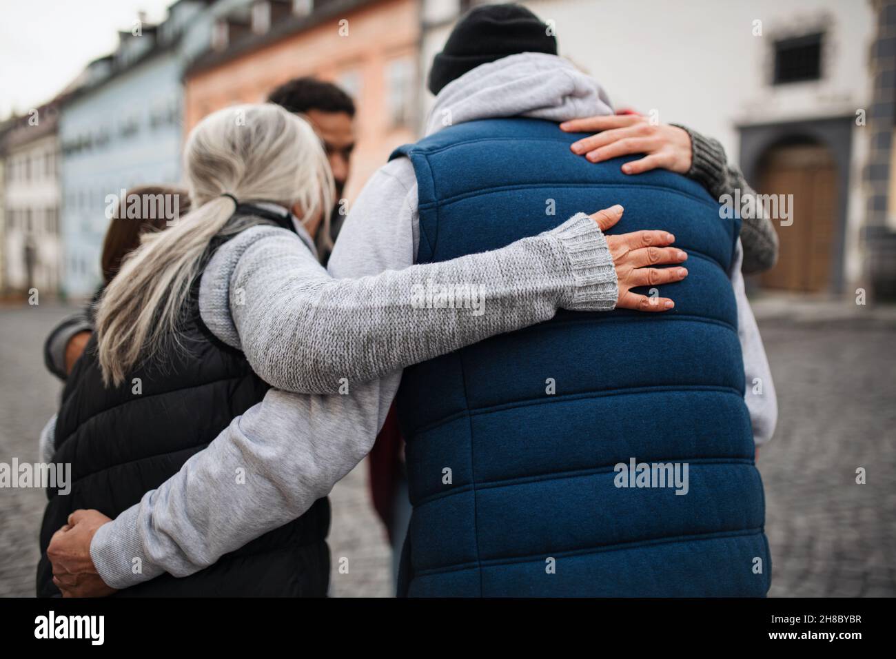 Group of people rear view hugging hi-res stock photography and images ...
