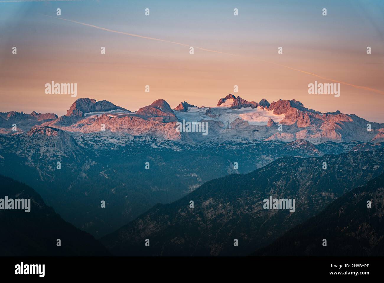 Sunrise in the Alps with alpenglow on the mountains Stock Photo - Alamy
