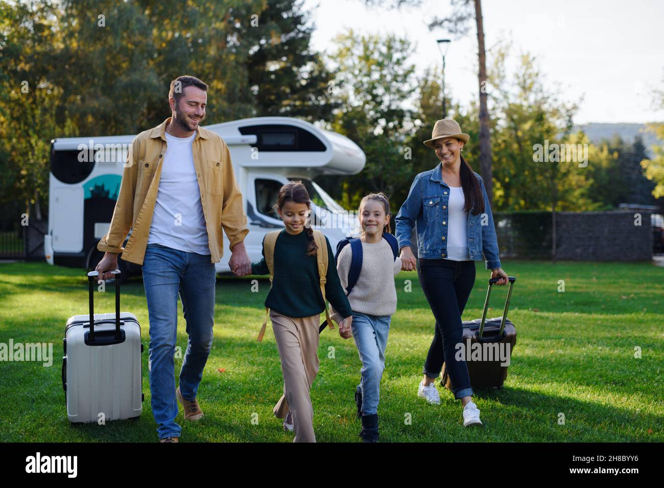 Family coming home from holiday hi-res stock photography and images - Alamy
