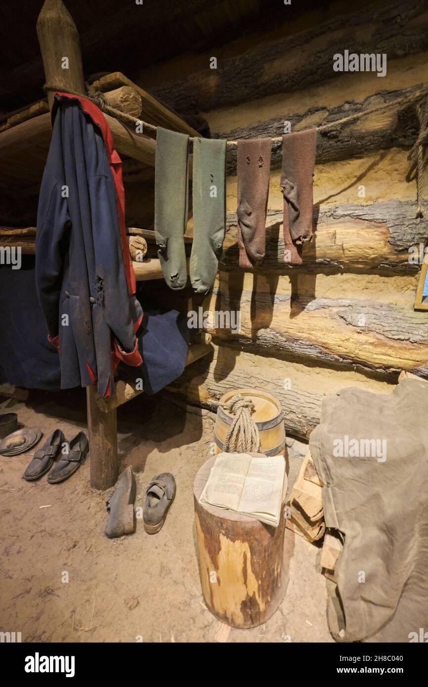 Clothes drying in a typical soldier's hut, bunk, quarters during the ...
