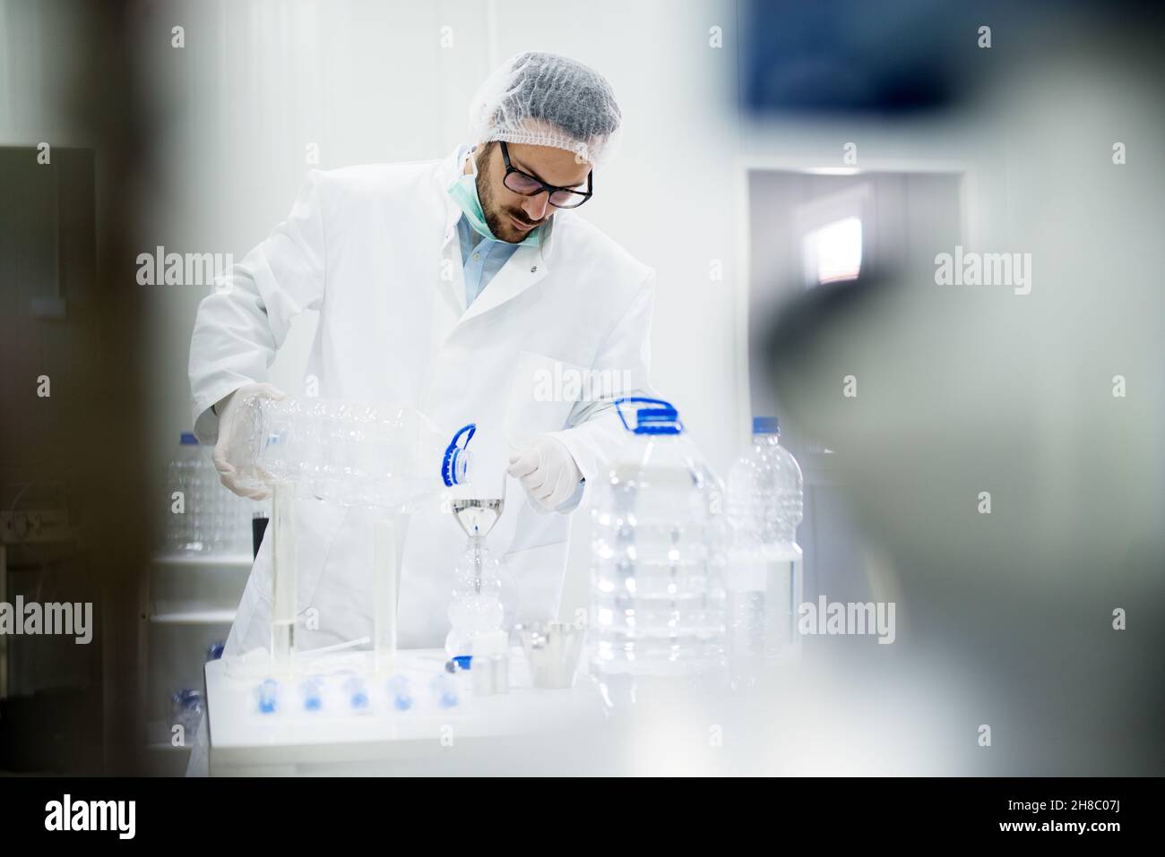 Lab technician doing chemical analysis. Testing chemical composition of ...