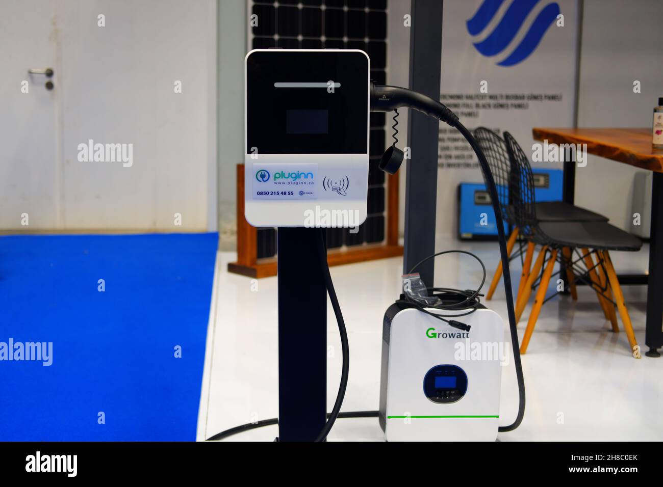 EV Charging Station and Solar Panel at Exhibition Indoor Stock Photo ...