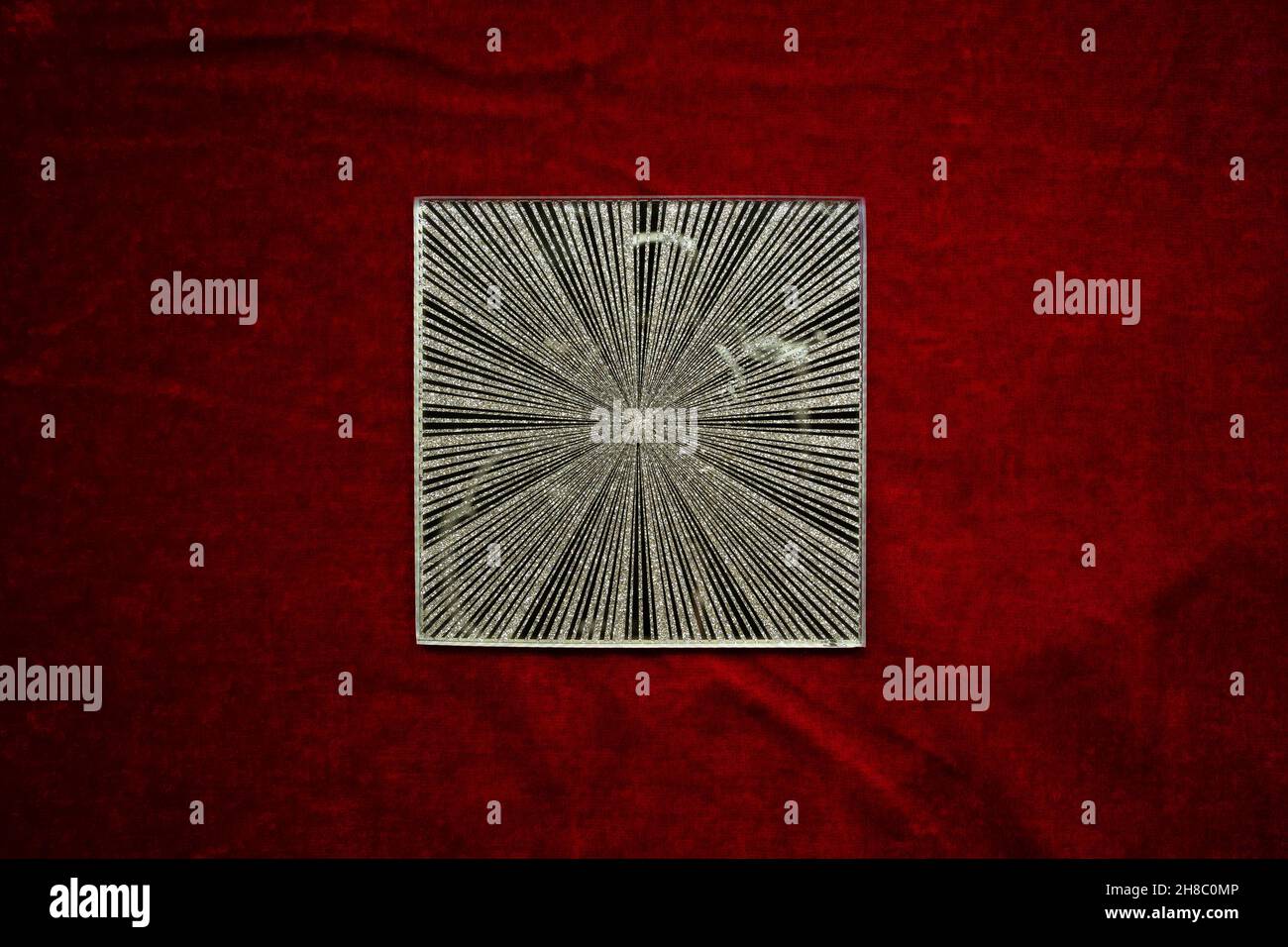 square gold starburst podium on bordo red velvet background. Christmas ...