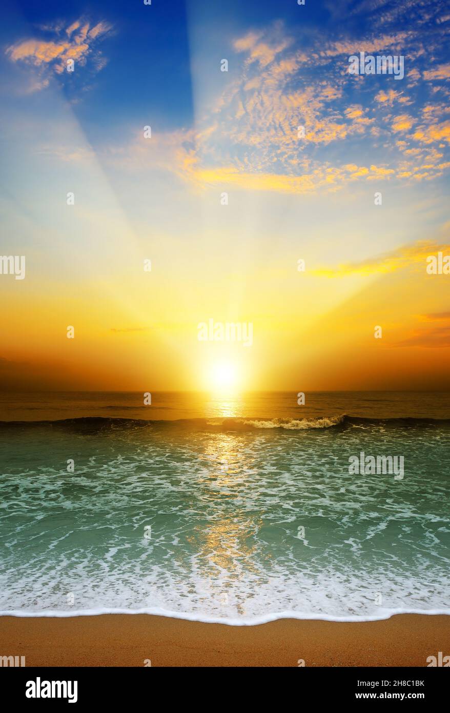 Fantastic sunset over ocean, sea waves and sand Stock Photo - Alamy
