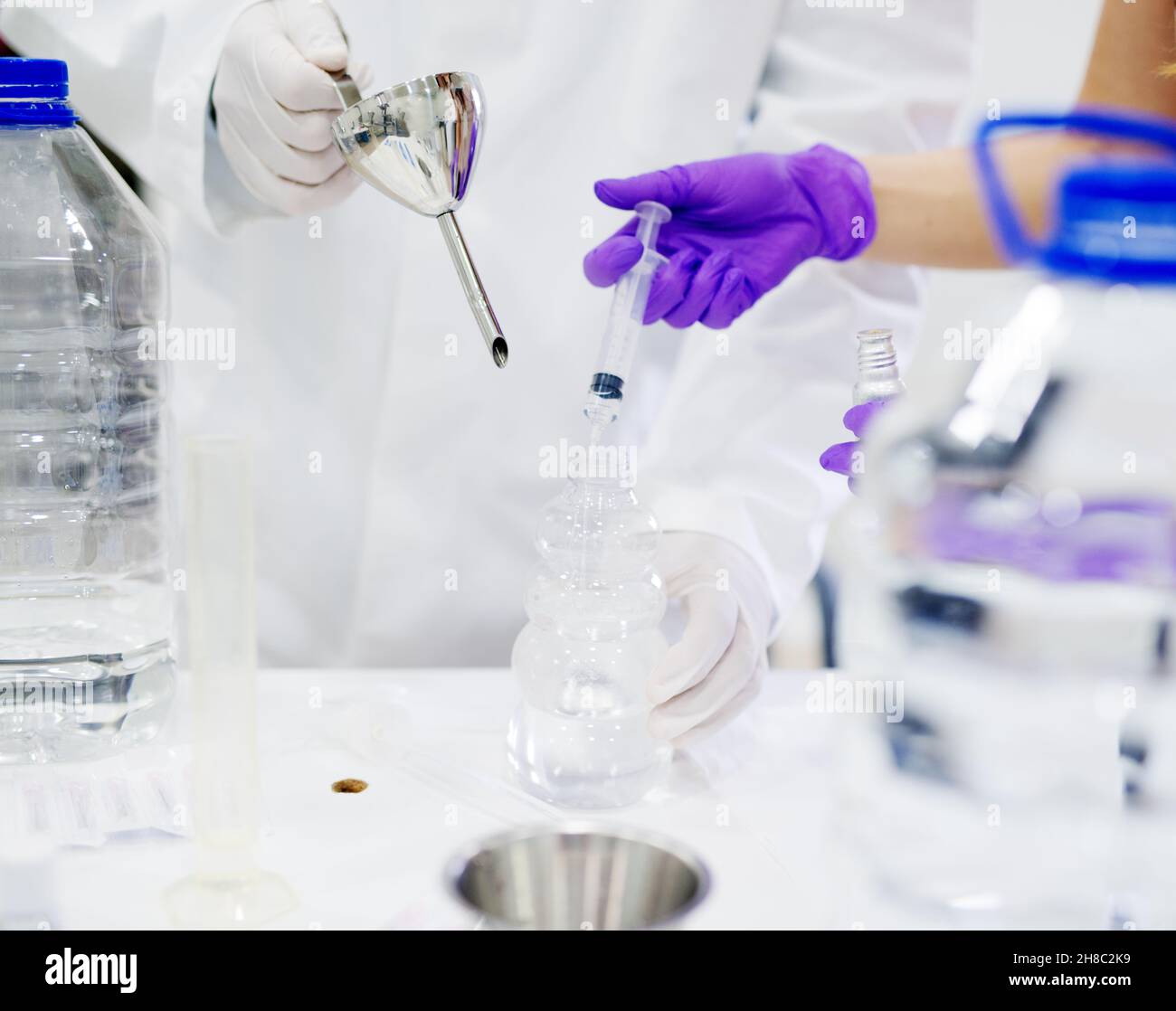 Lab technicians doing chemical analysis. Testing chemical composition ...