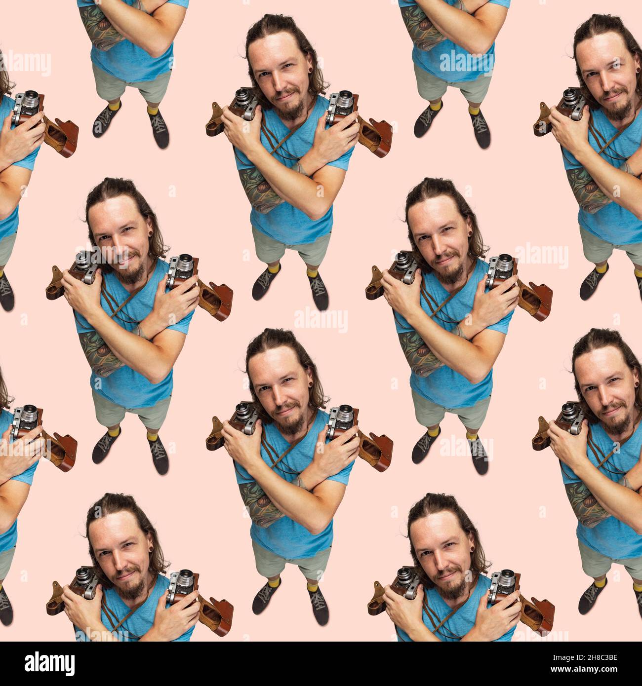 Seamless pattern made of portraits of male cameraman with retro camera ...