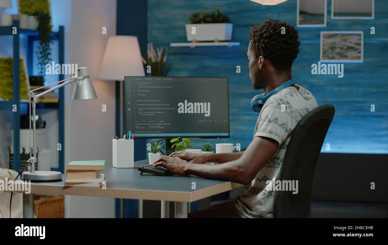 Programmer using binary code for website interface development on ...