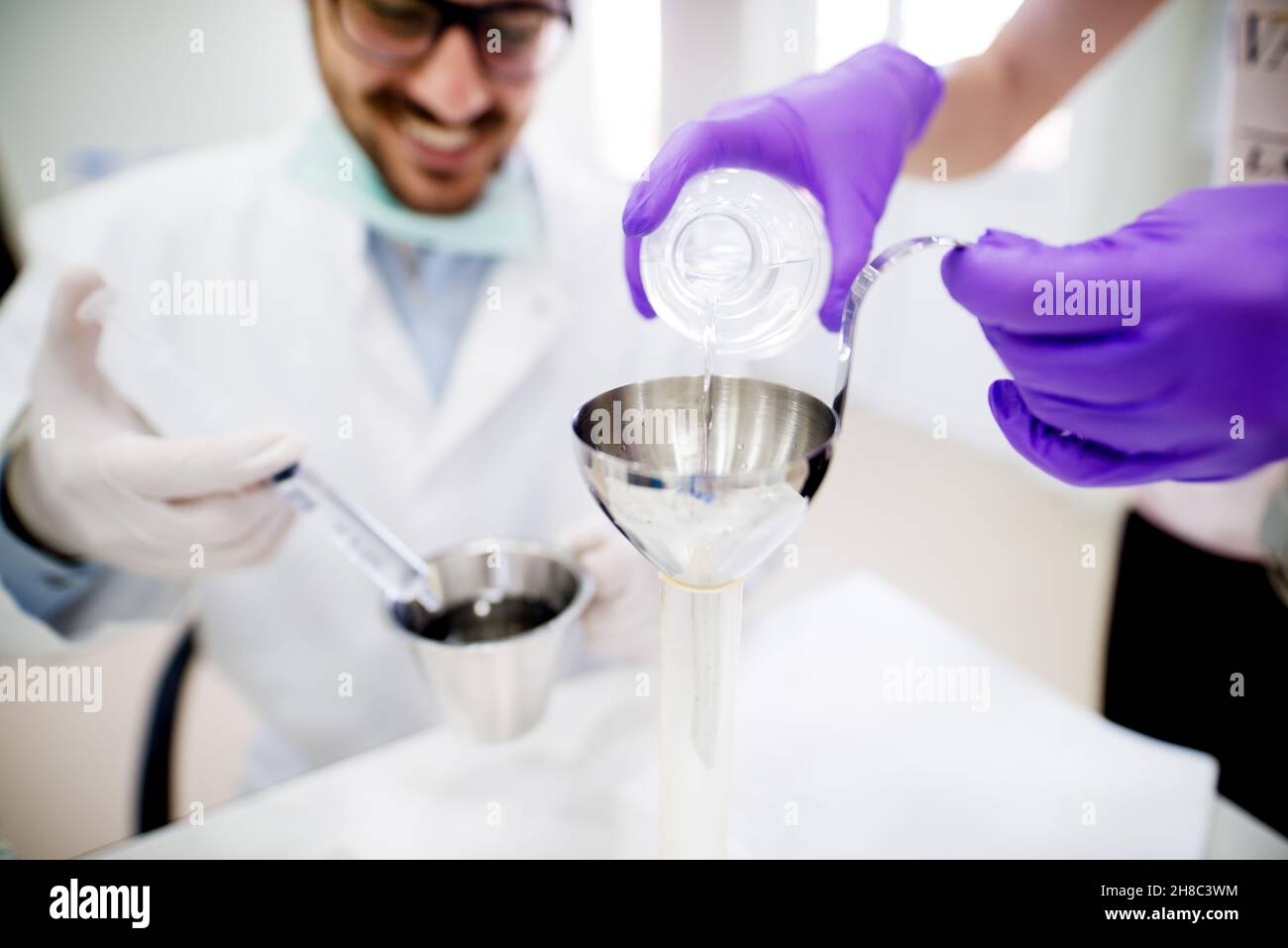 Lab technicians doing chemical analysis. Testing chemical composition ...