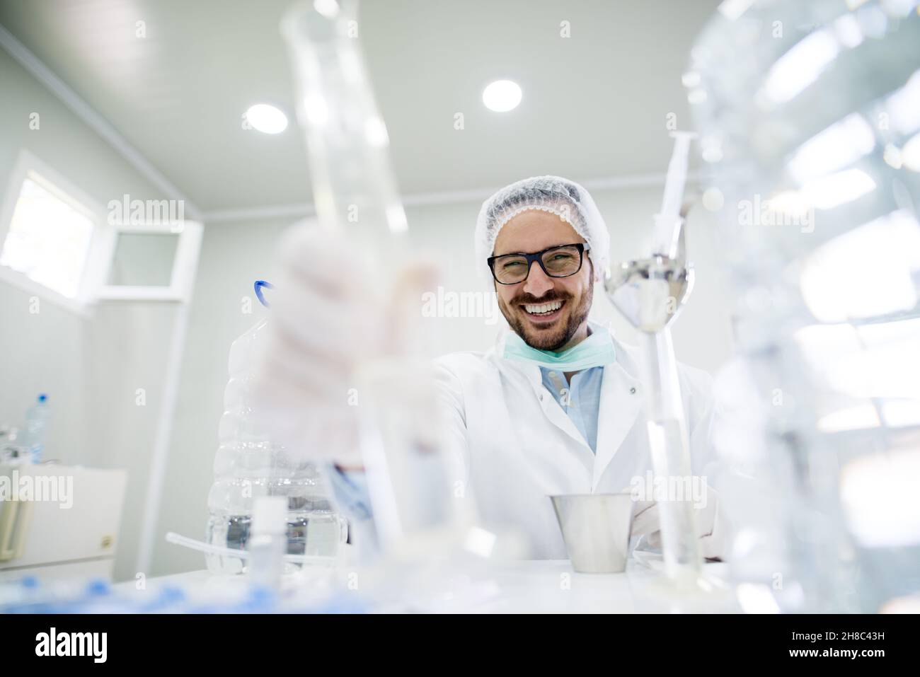 Lab technician doing chemical analysis. Testing chemical composition of ...