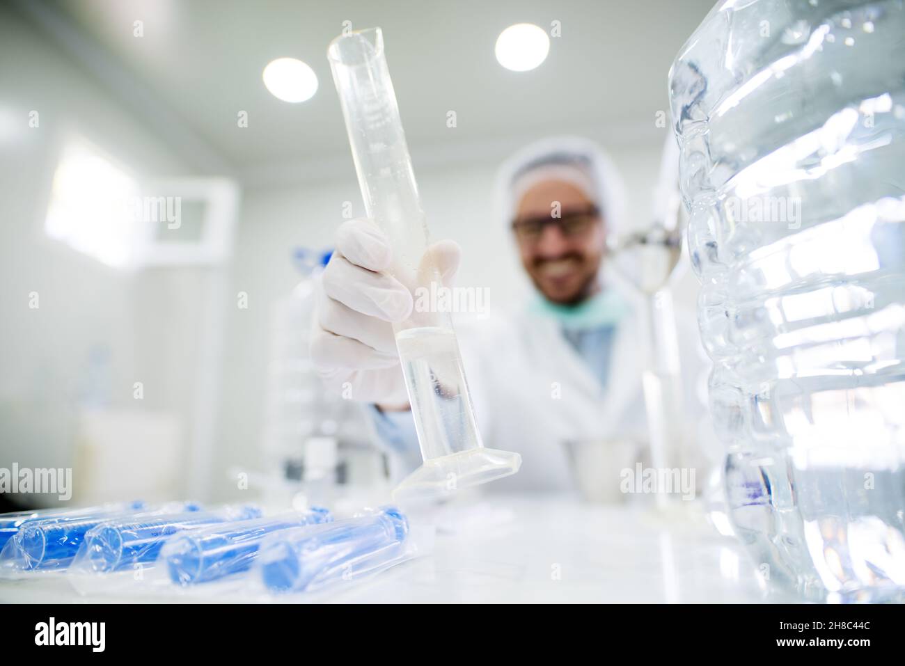 Lab technician doing chemical analysis. Testing chemical composition of ...