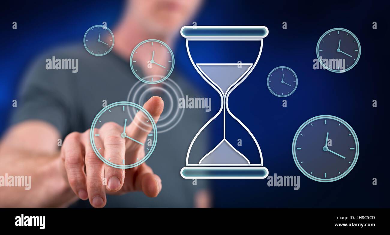 Man touching a time management concept on a touch screen with his ...