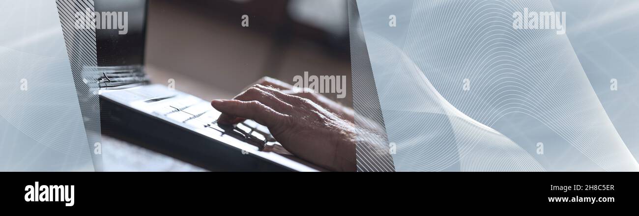 Hands typing on a laptop, hard light effect. panoramic banner Stock ...