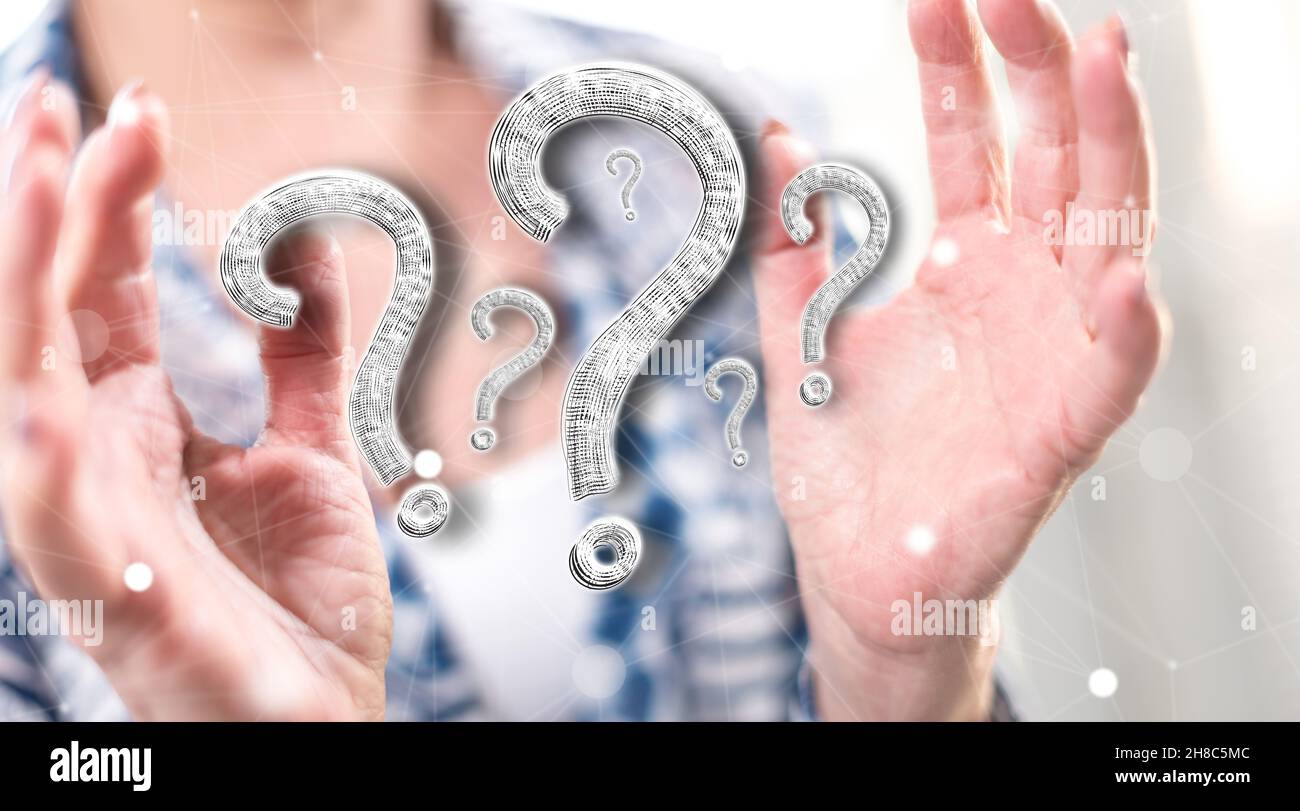 Question concept between hands hi-res stock photography and images - Alamy
