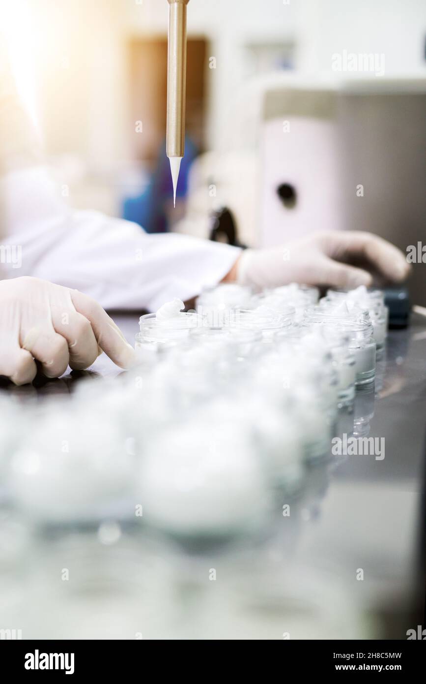 Pharmacy technician hands. Man working with laboratory beakers and ...
