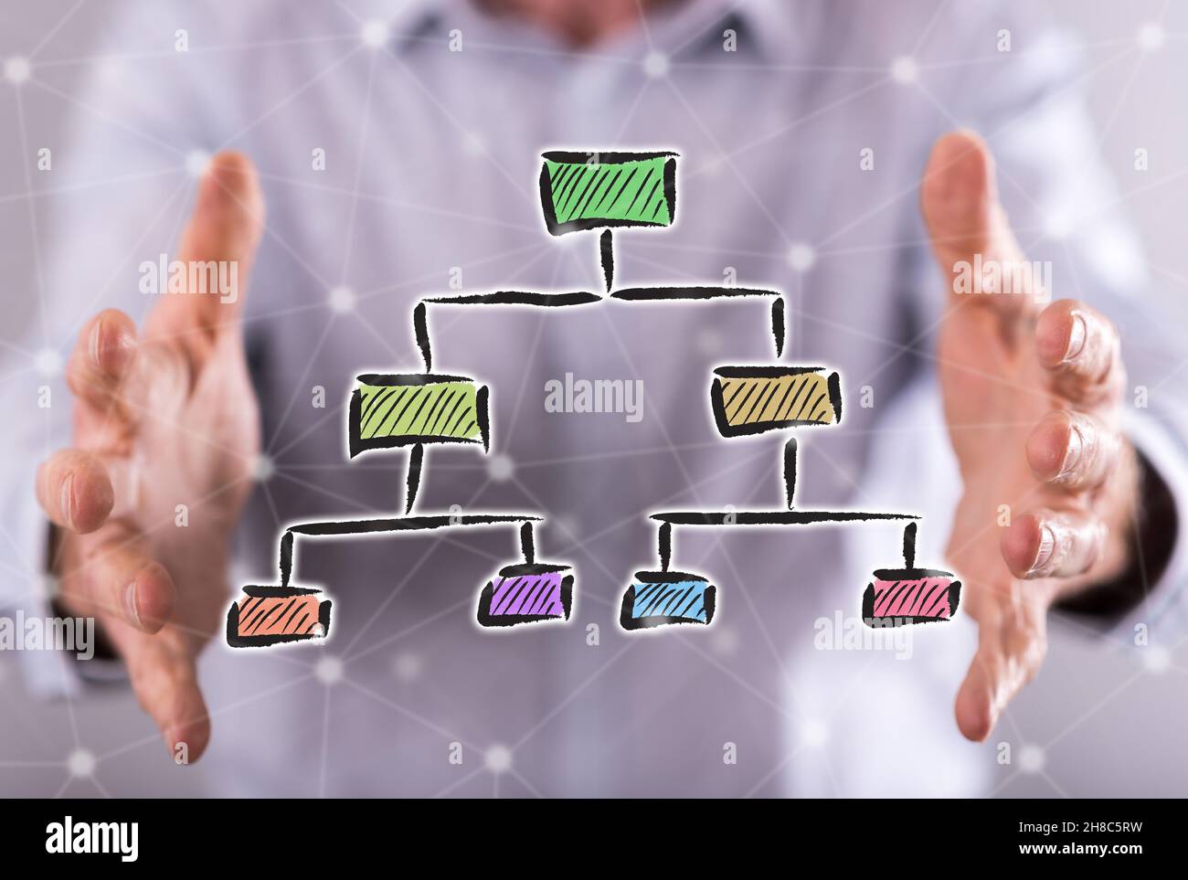 Organizational chart concept between hands of a man in background Stock ...