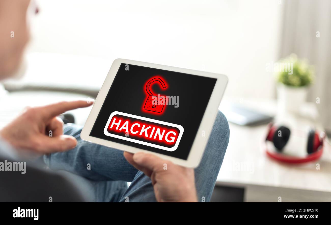 Tablet screen displaying a hacking concept Stock Photo - Alamy