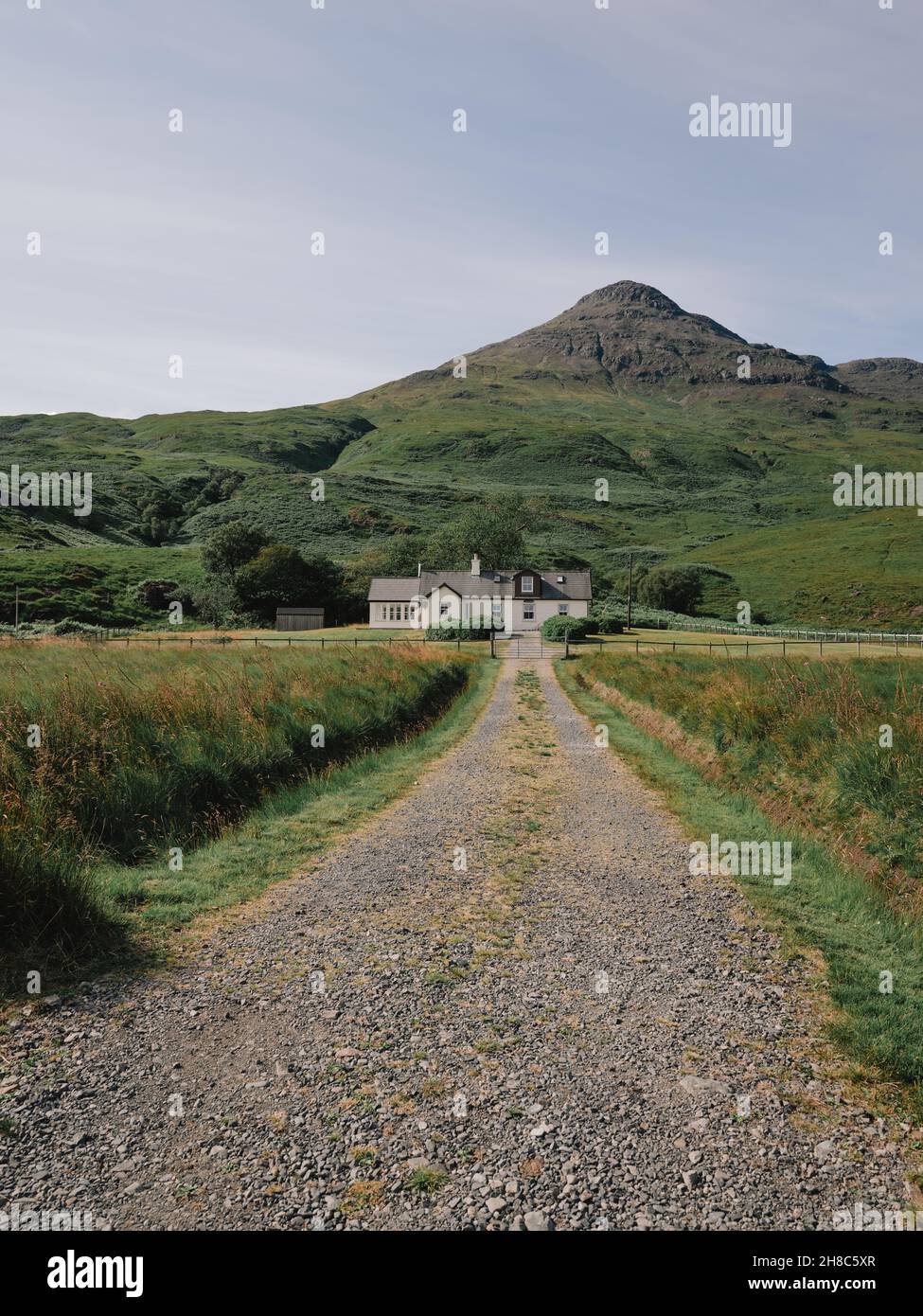 A lone typical white croft house at the end of a track in the remote ...