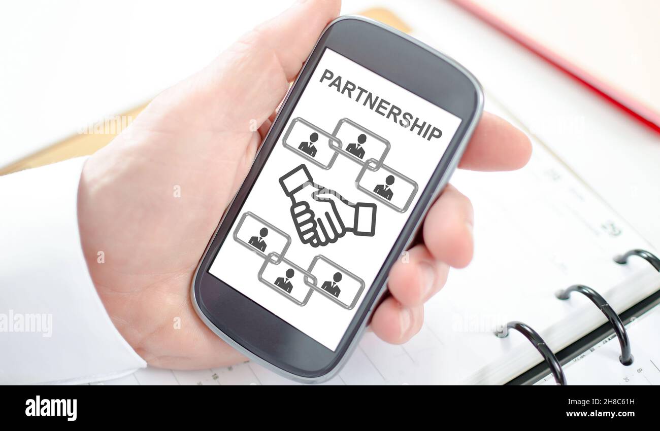 Business partnership concept shown on a smartphone screen Stock Photo ...