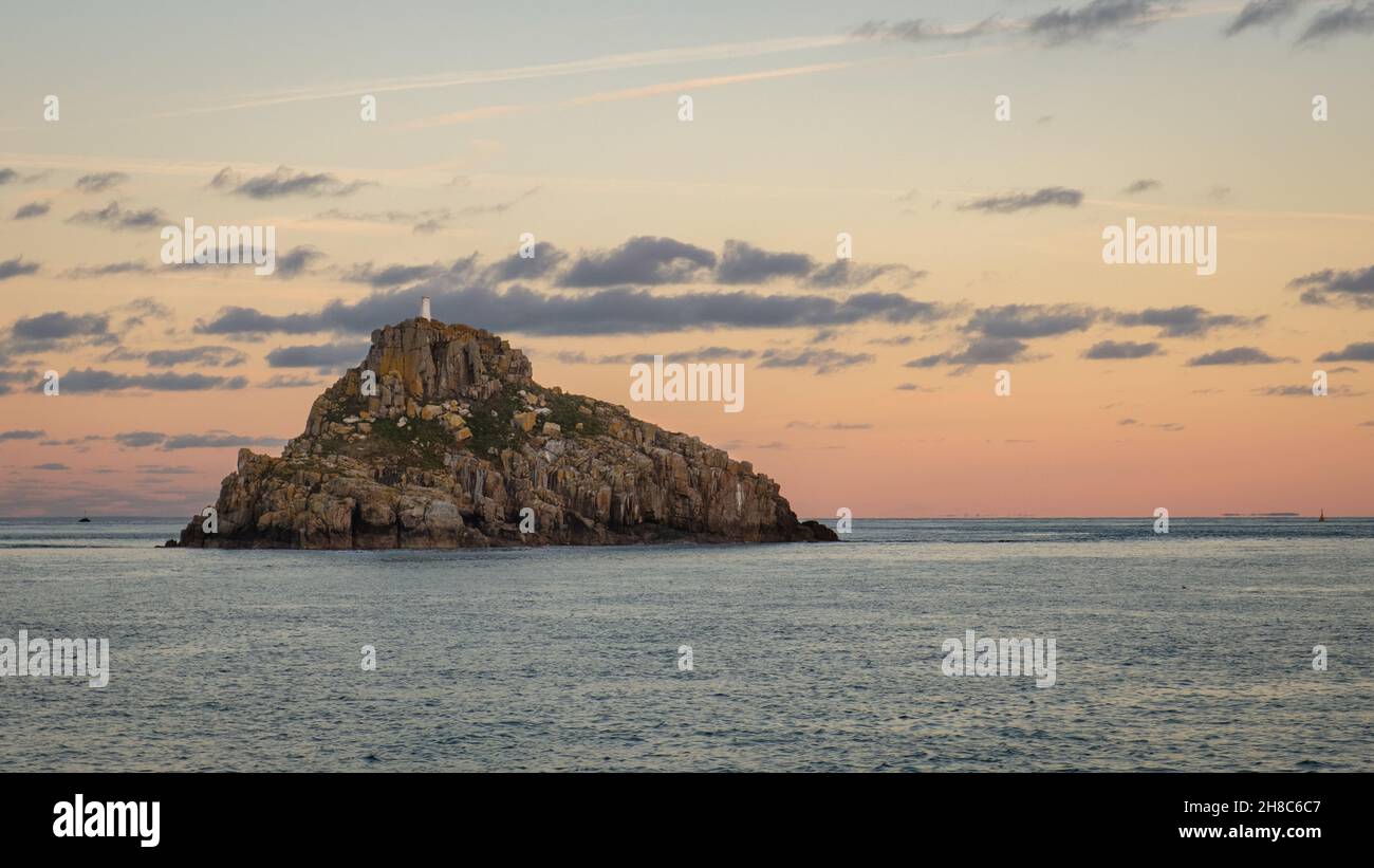 Sunset over Grand Fauconniere Rock, Herm, Channel Islands Stock Photo ...