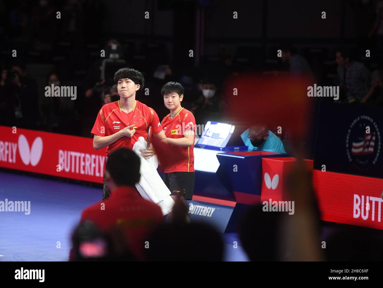 Houston. 28th Nov, 2021. China's Wang Chuqin/Sun Yingsha (R) react ...
