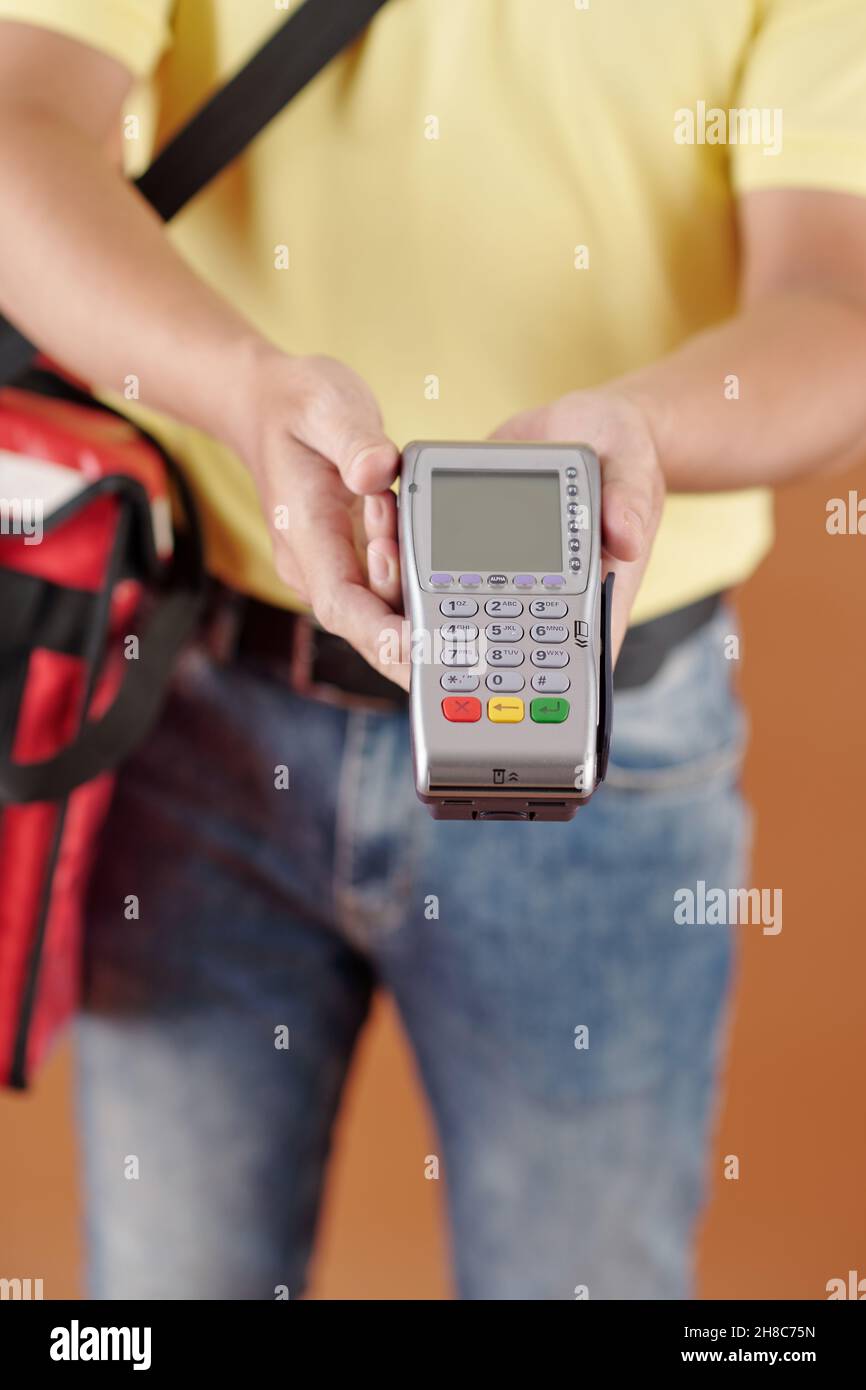 Male courier payment terminal hi-res stock photography and images - Alamy
