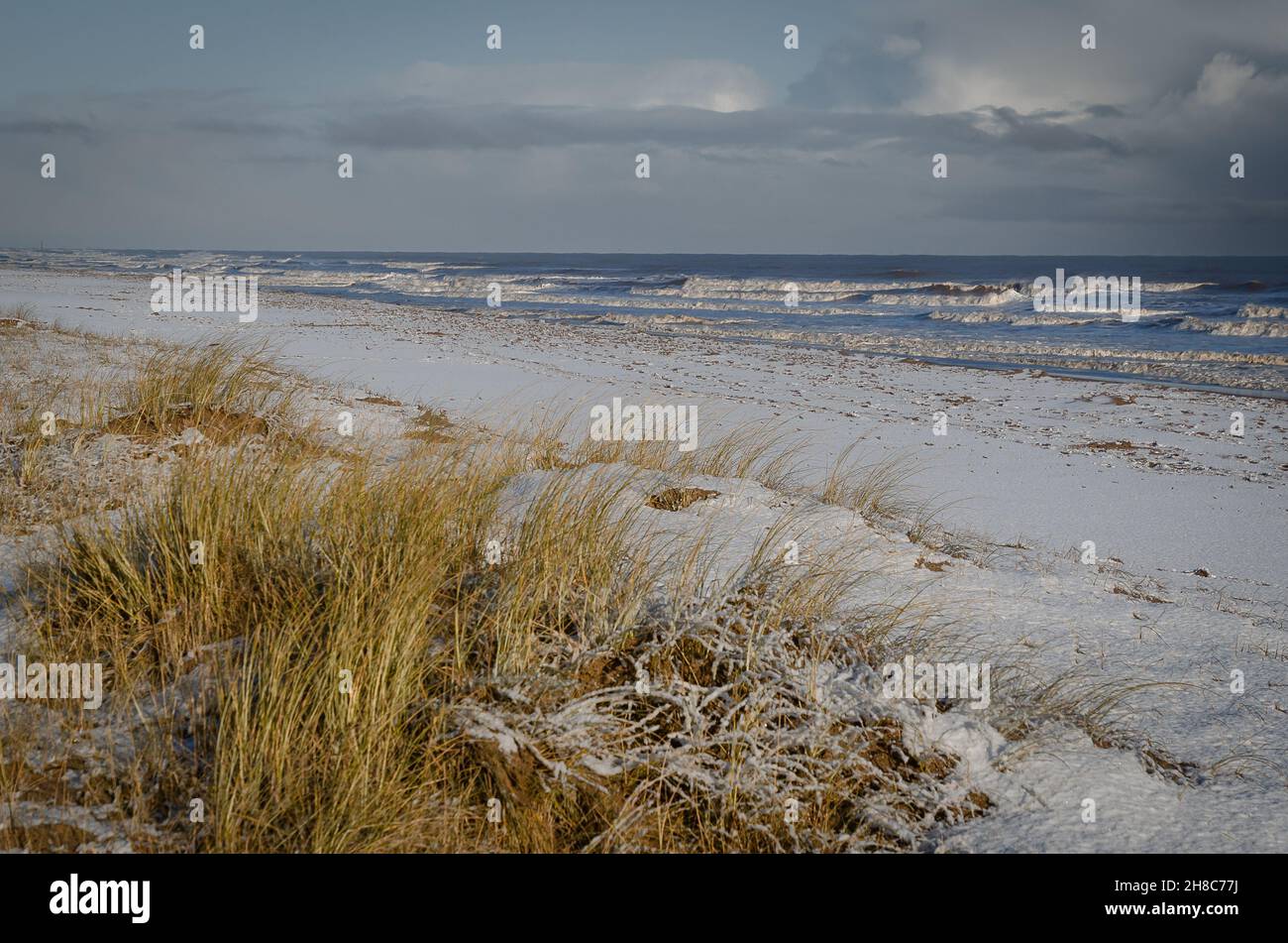 Snow on the beach Stock Photo - Alamy