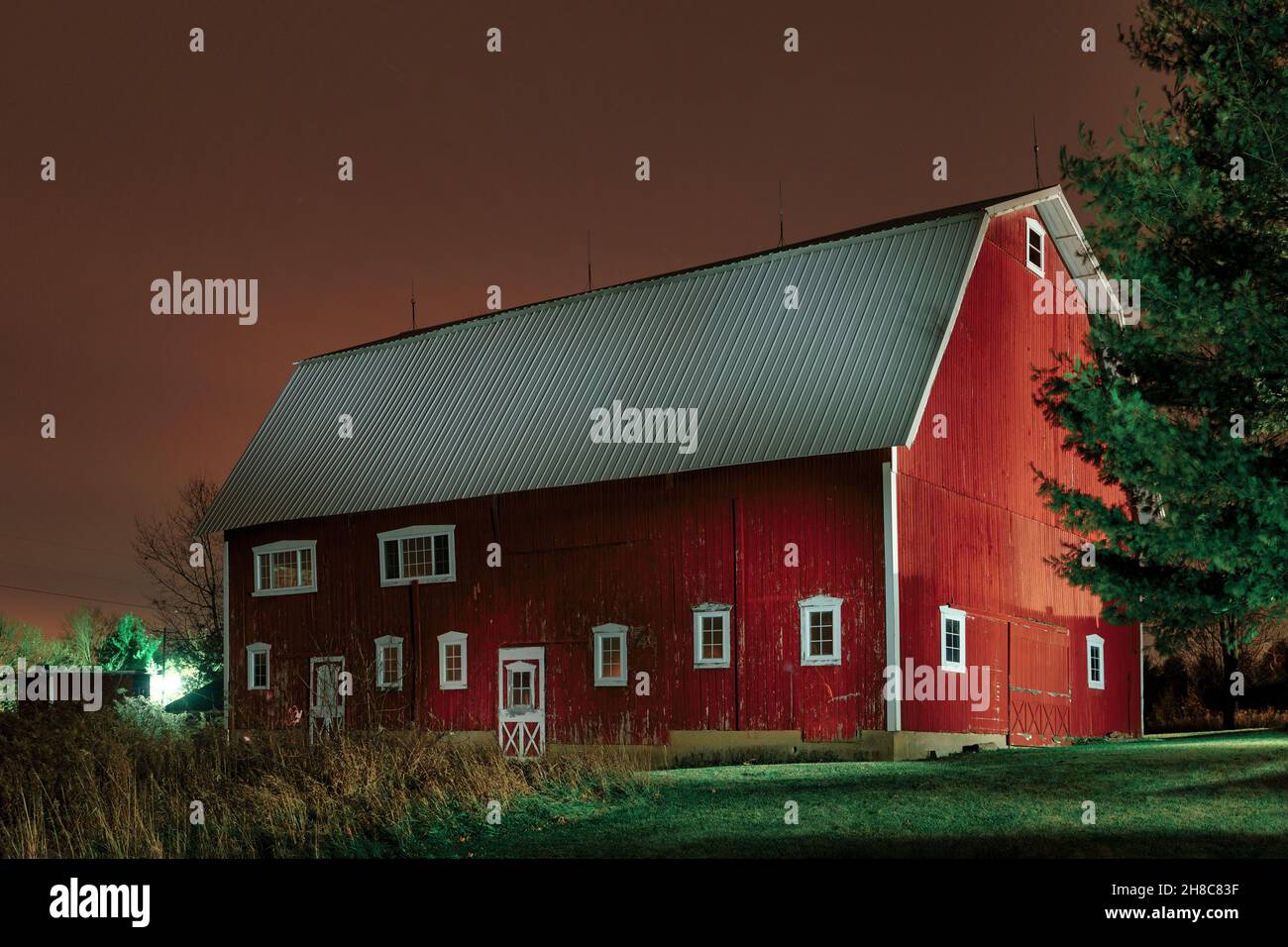 Eerie scenery of an old red barn at sunset in Michigan Stock Photo - Alamy