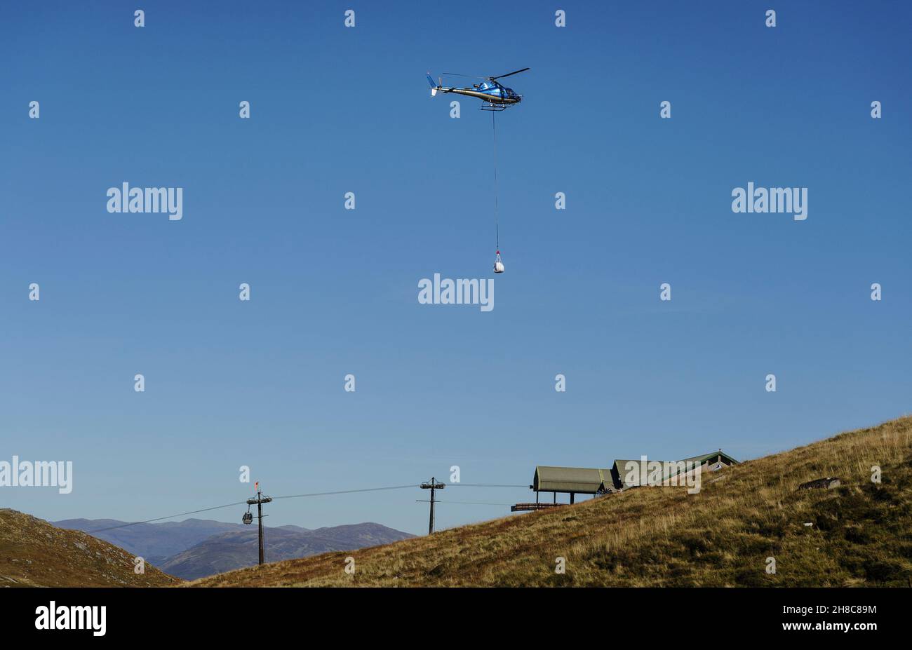Skyhook helicopter transporting materials to the Nevis Range Mountain ...