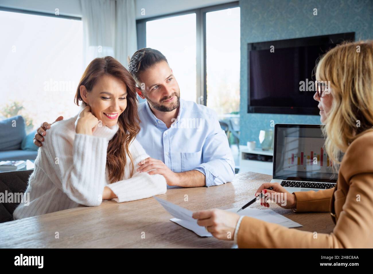 Shot of financial advisor showing and discussing some data with her ...