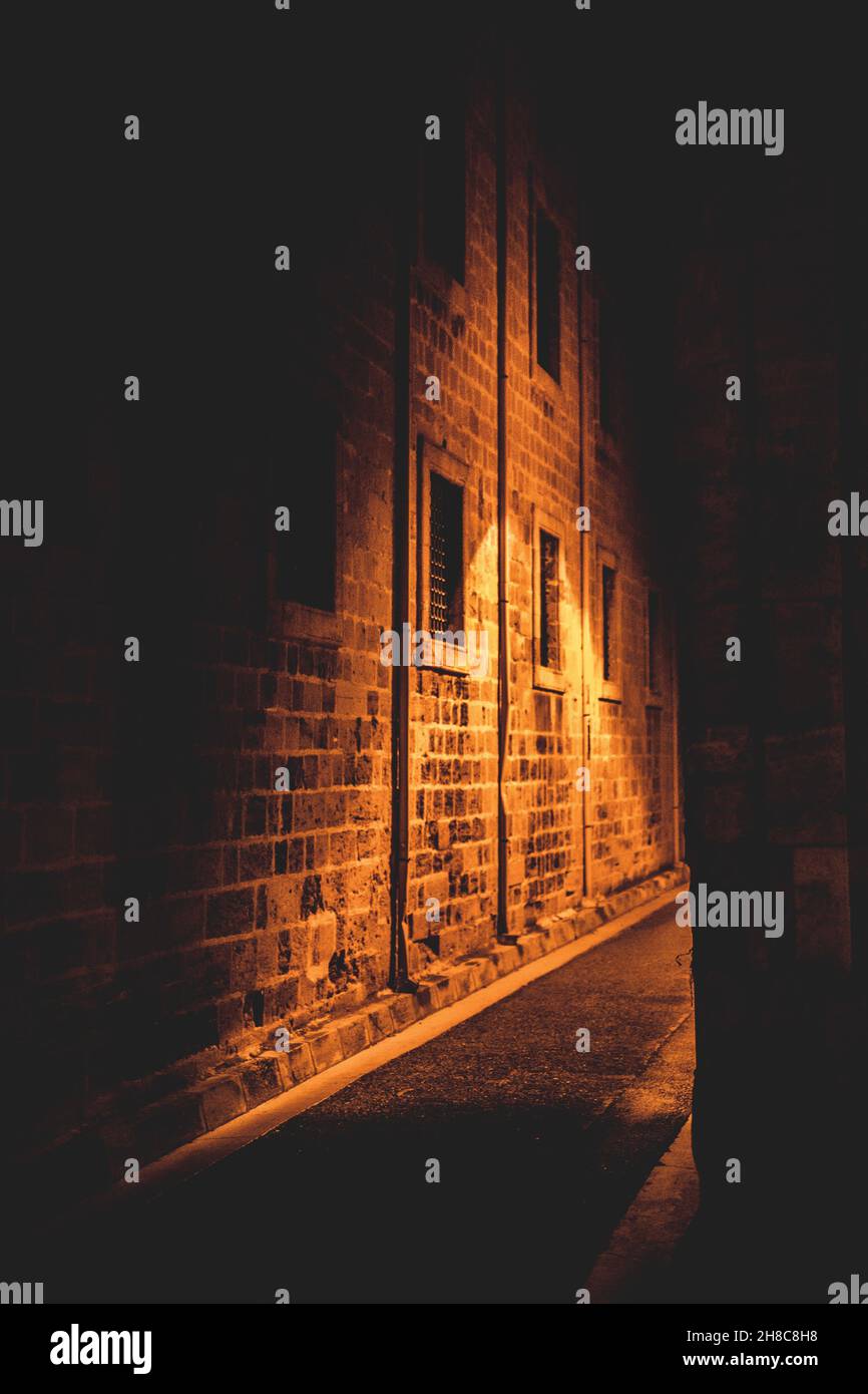 Night narrow street between brick hi-res stock photography and images ...