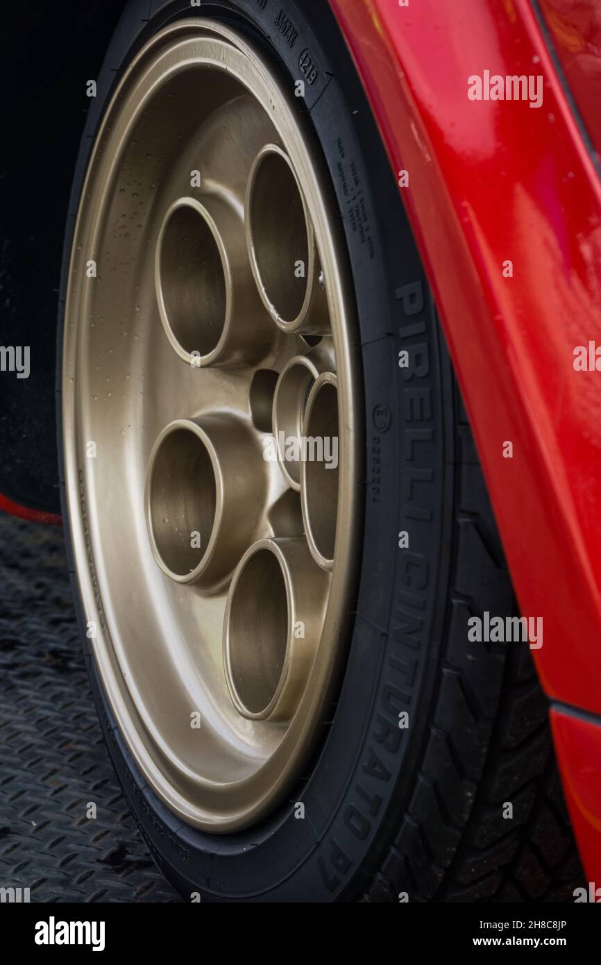 Close up detail of a gold Campagnolo Bravo alloy wheel on a red ...