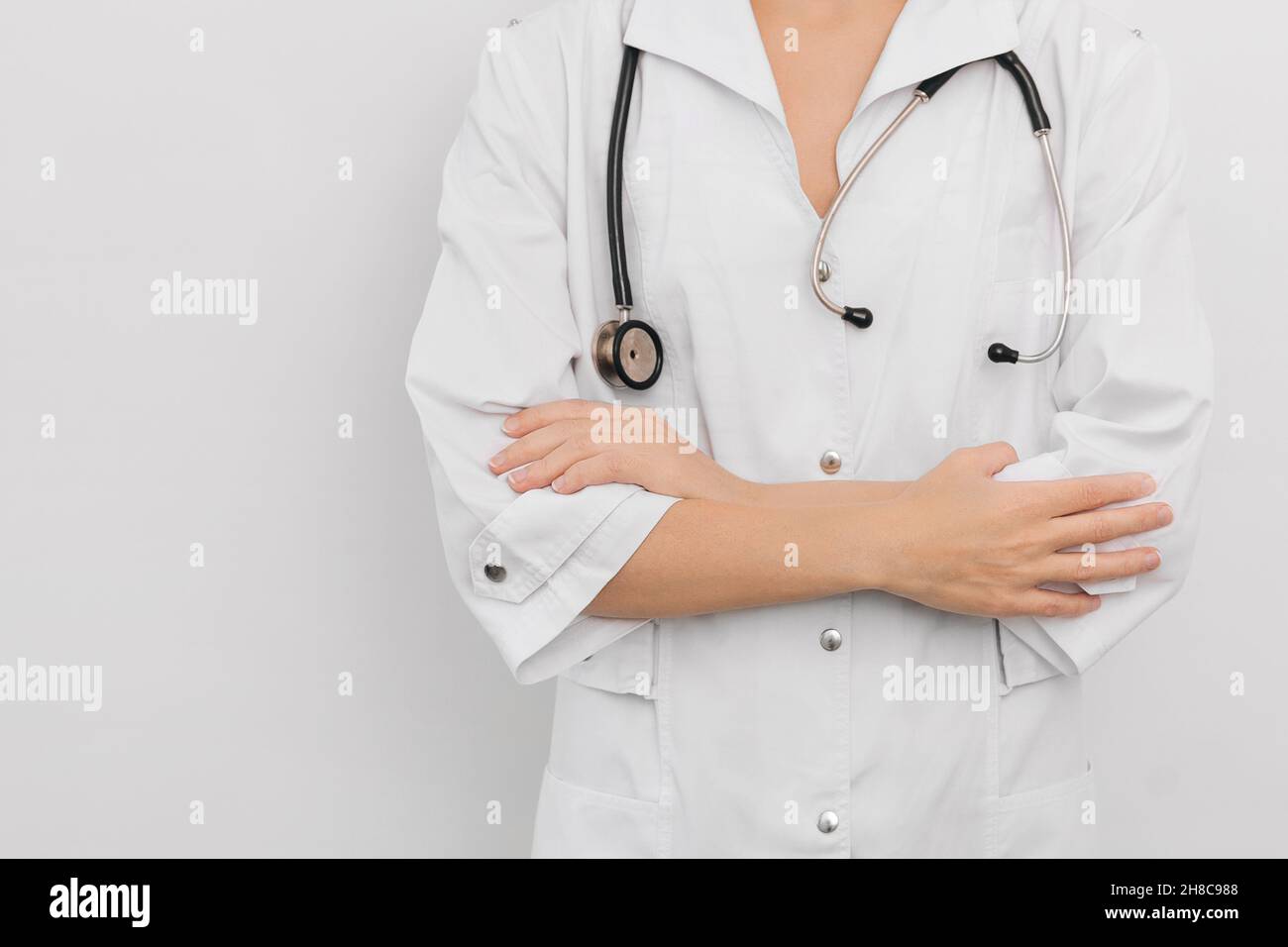 Doctor with stethoscope in medical coat on white background. Front ...