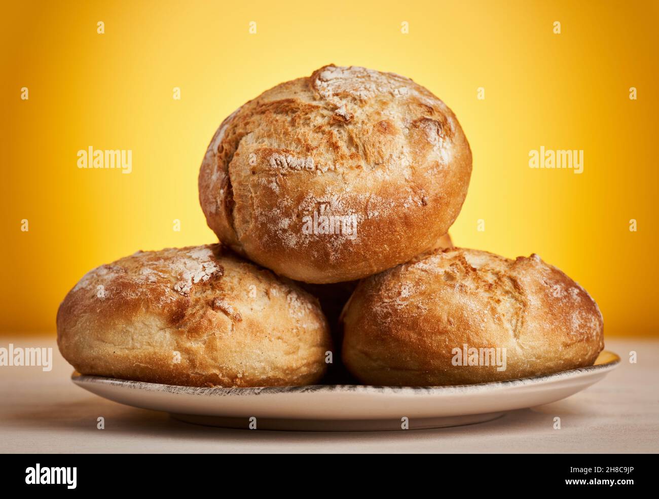 A pile of healthy whole grain bread buns on a plate Stock Photo - Alamy