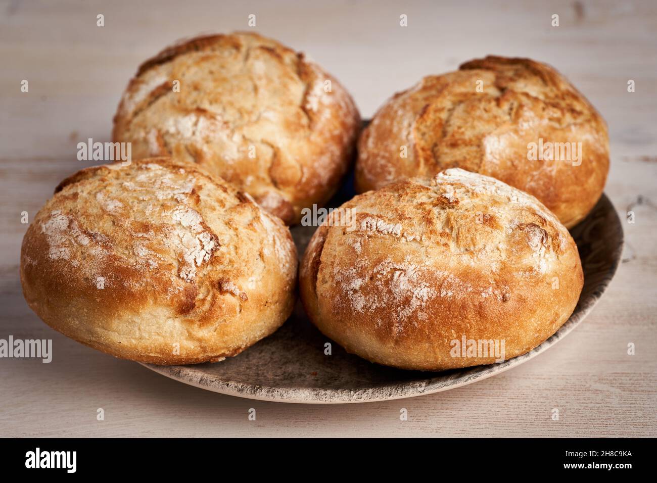 A pile of healthy whole grain bread buns on a plate Stock Photo - Alamy