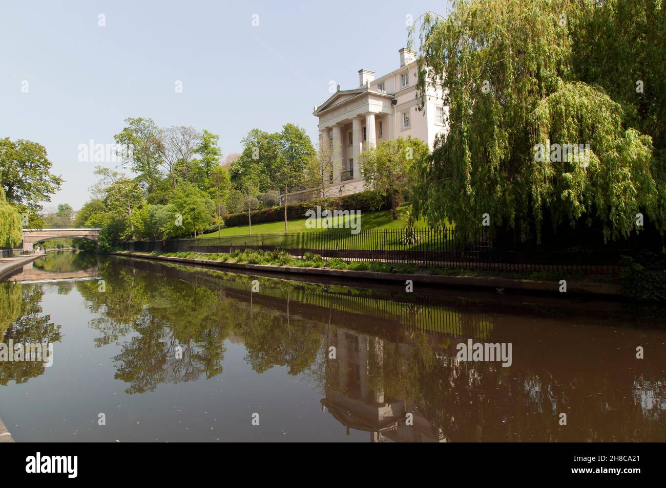 View of an imposing Mansion and its reflection in the still waters of ...