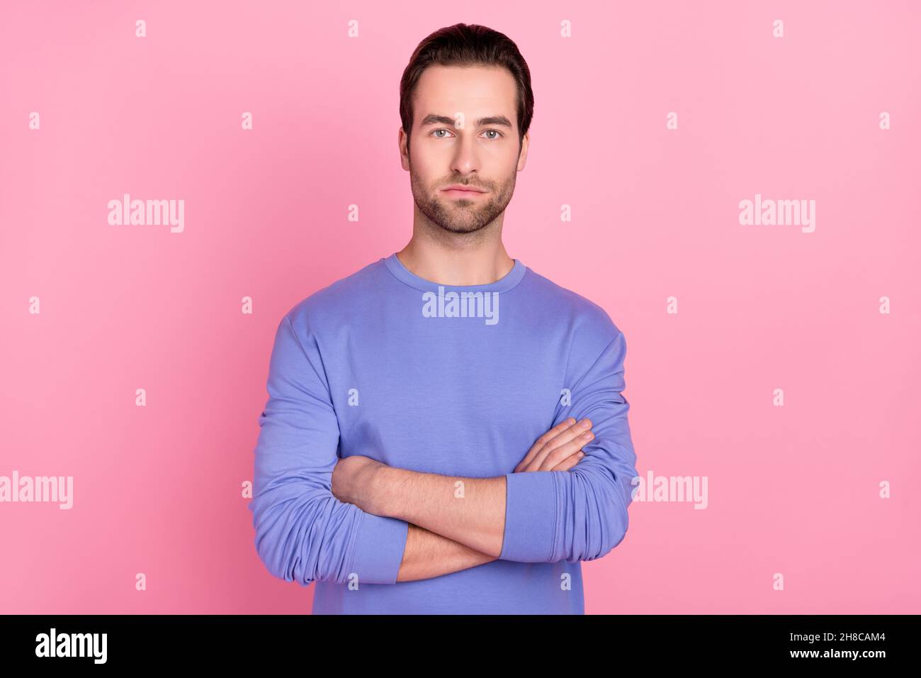 Photo of brunet cool guy crossed palms wear blue pullover isolated on ...