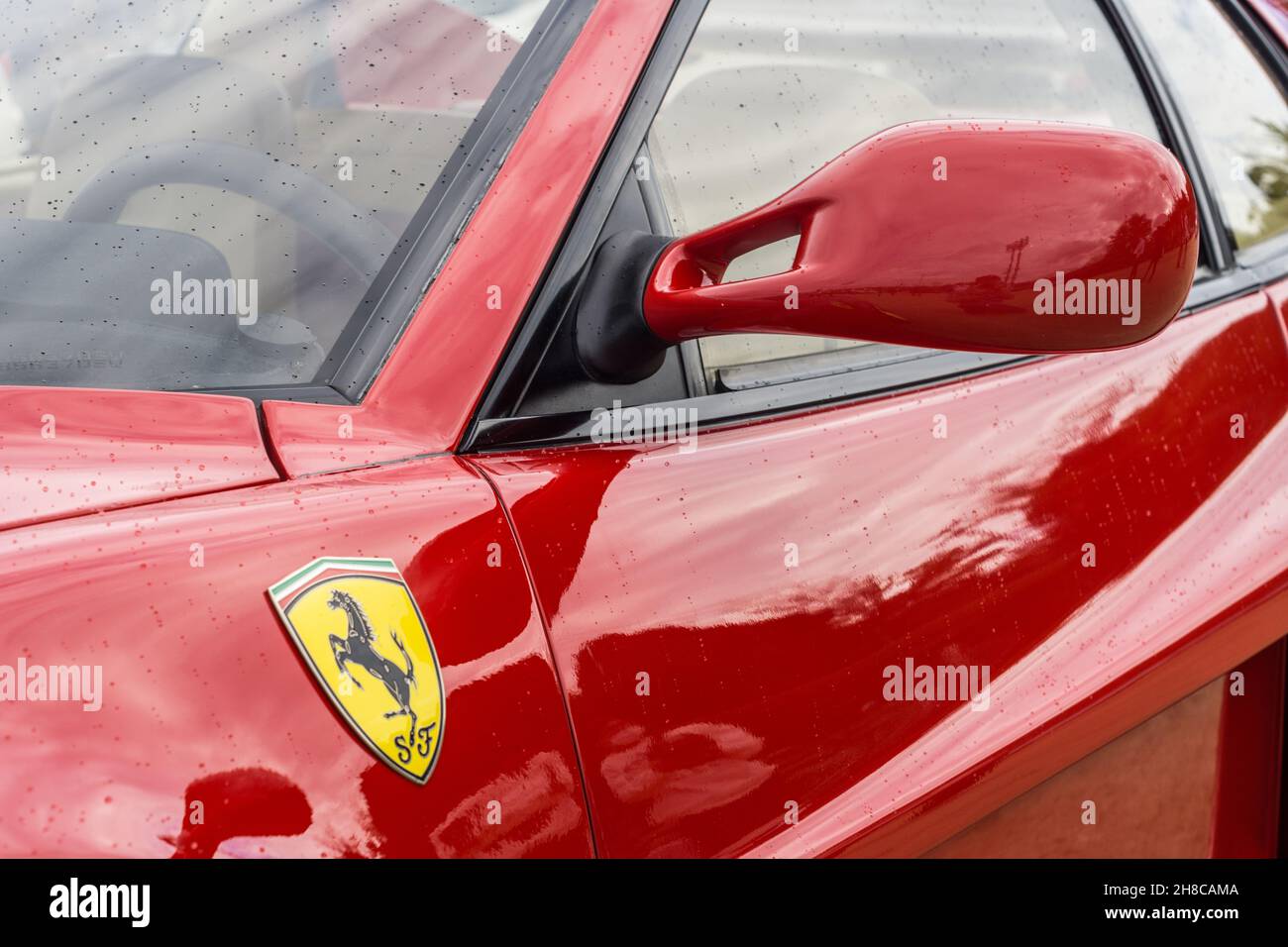 Close up detail of on a customised slammed rosso corsa Ferrari ...