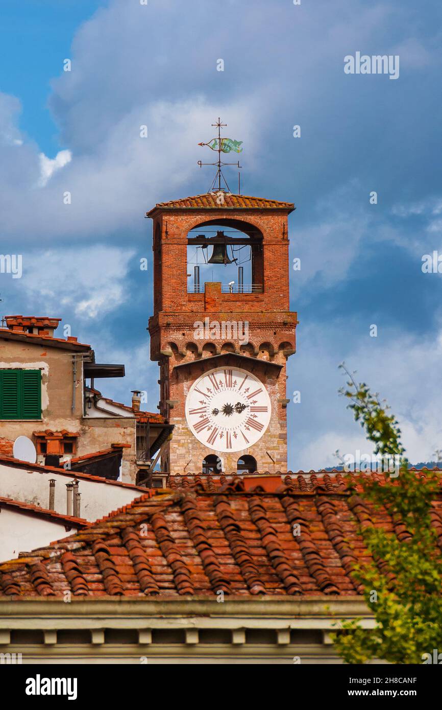 Lucca medieval 'Torre delle Ore' (Clock Tower), a city landmark, rises ...