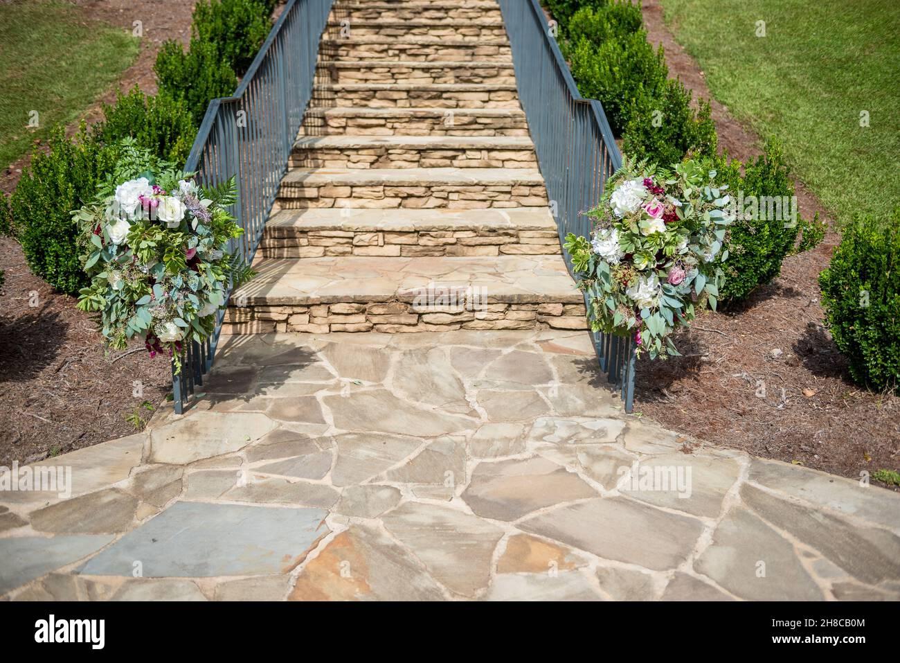 Floral decoration of a stairs and entrance Stock Photo - Alamy