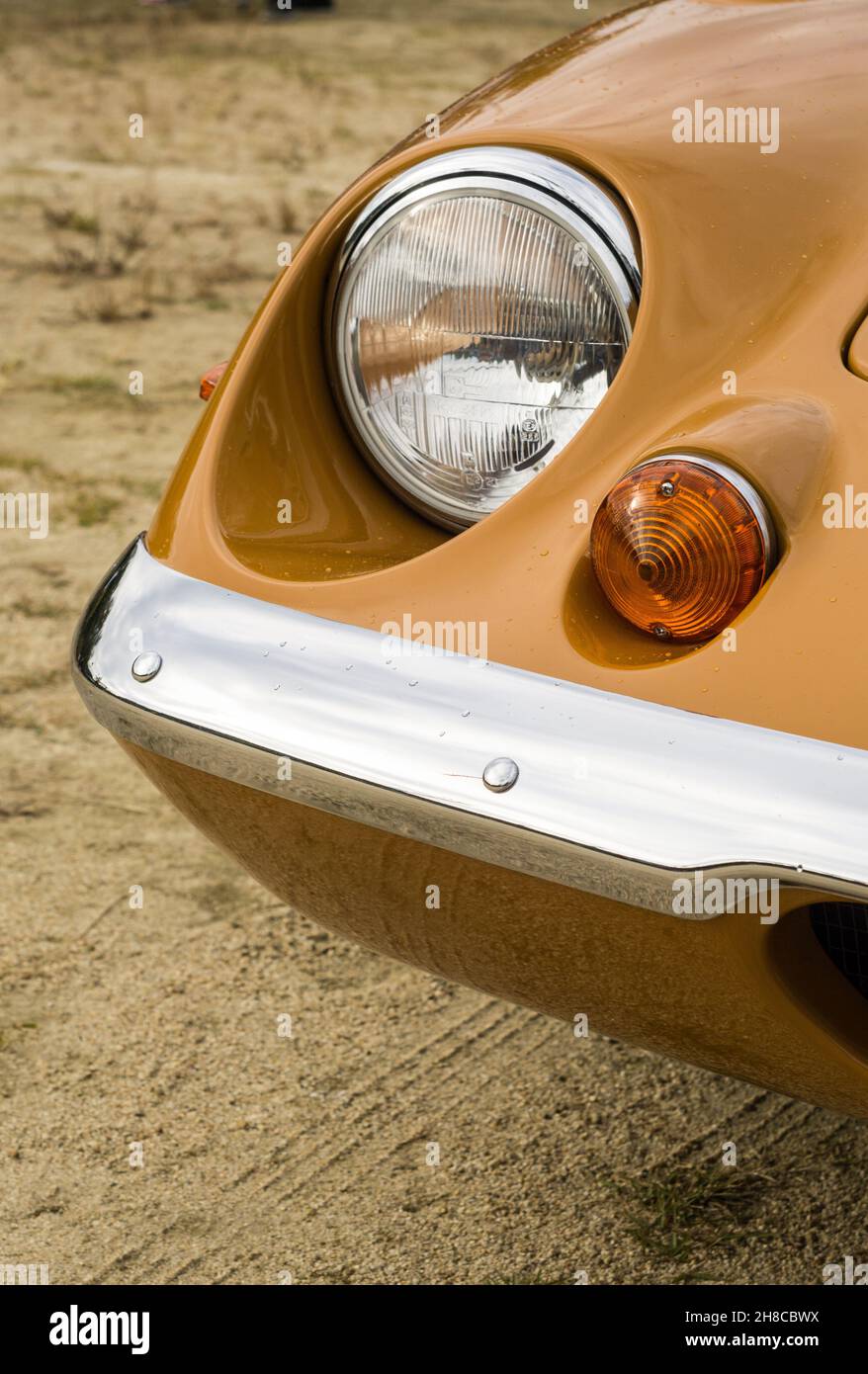 Close up detail of the headlight and indicator on a Bahama yellow Lotus ...