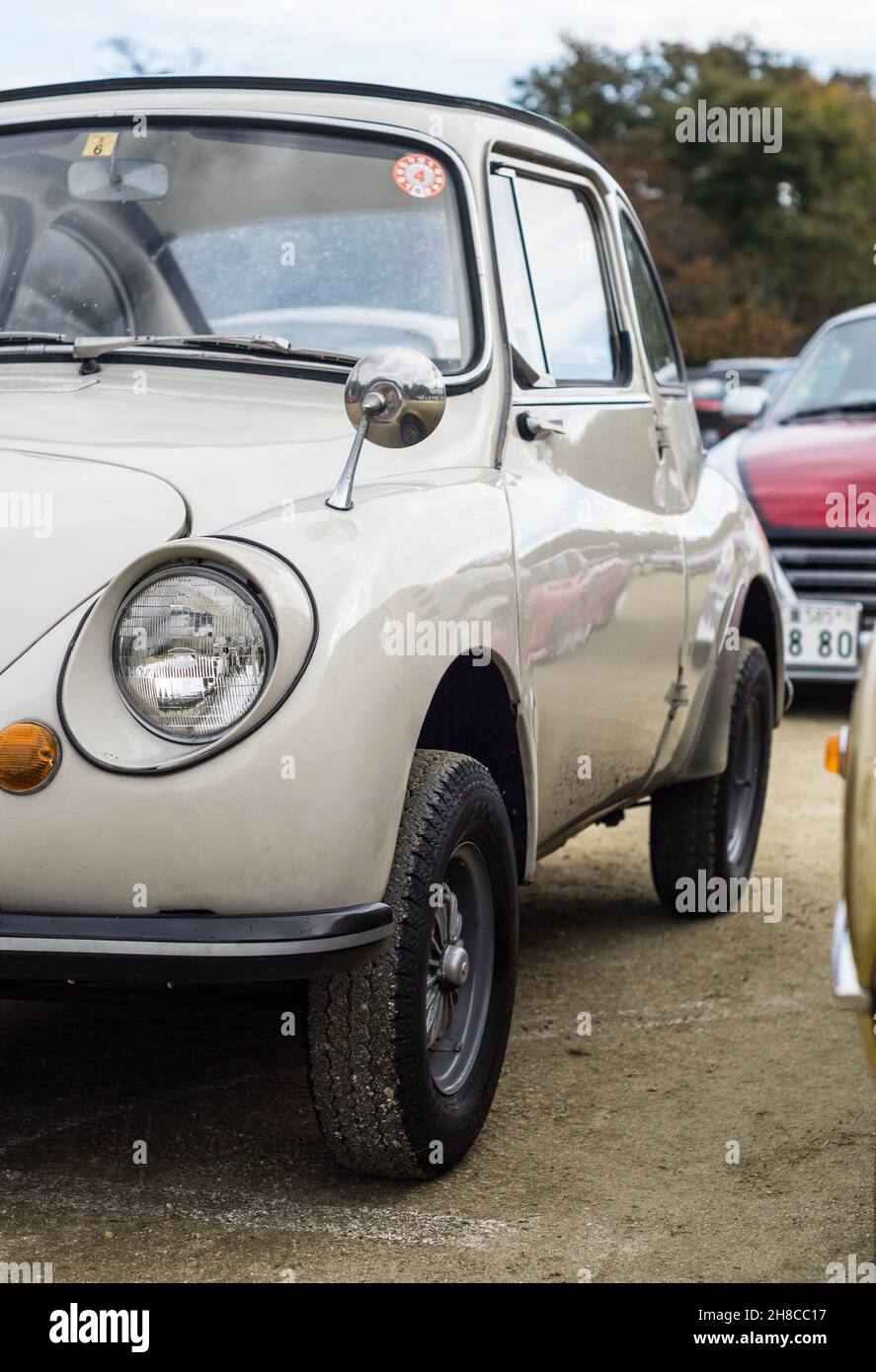 Close up detail of the front and side of a white Subaru 360 Deluxe ...
