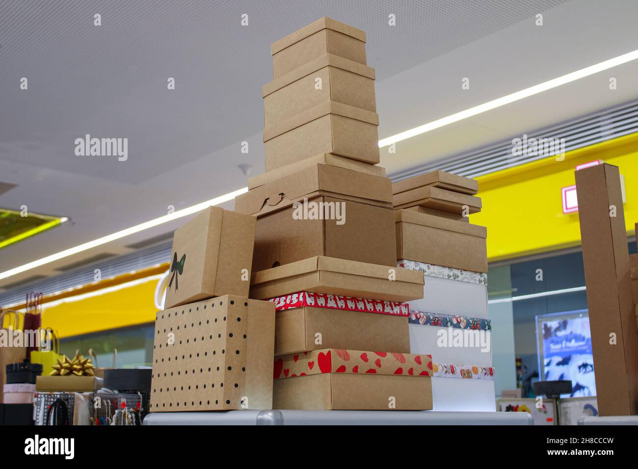 big pile a stack of cardboard holiday boxes and gift packages on ...