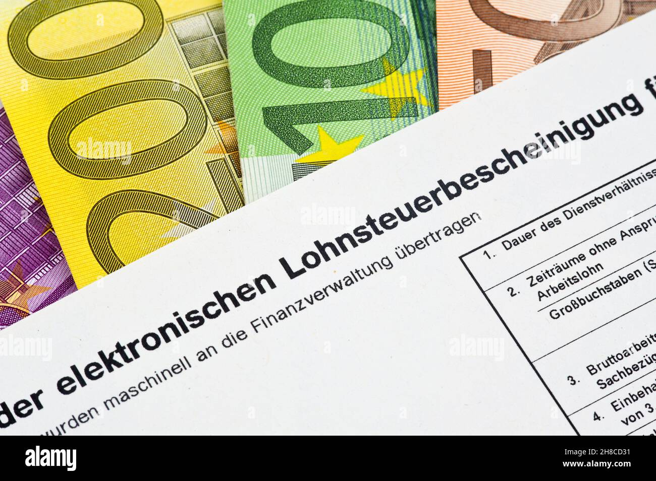 German wage and tax statement with Euro bills, Germany Stock Photo - Alamy