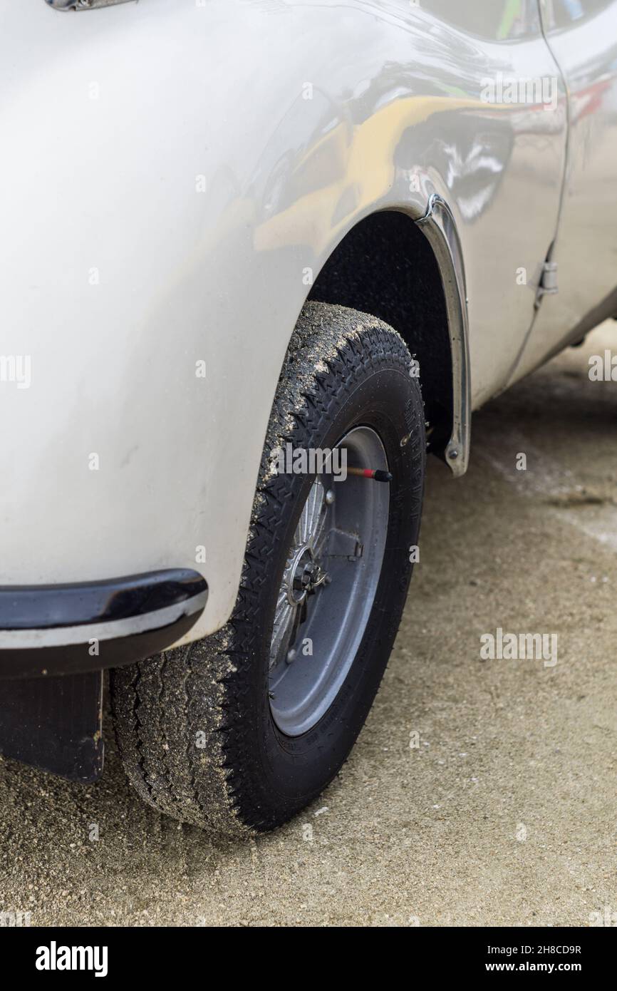 Close up detail of the rear wheel on a white Subaru 360 Deluxe Japanese ...