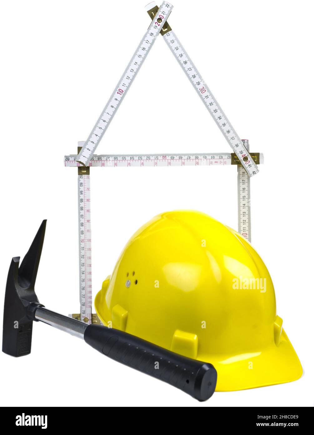 hammer, helmet and folding rule, forming a house Stock Photo - Alamy