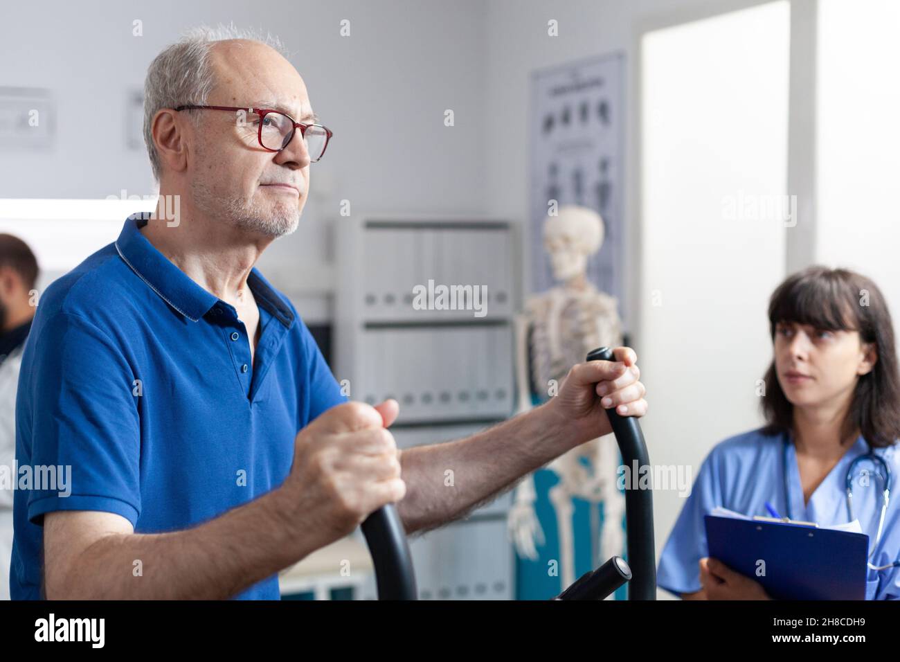 Patient doing exercises with sport equipment and gear for physical ...