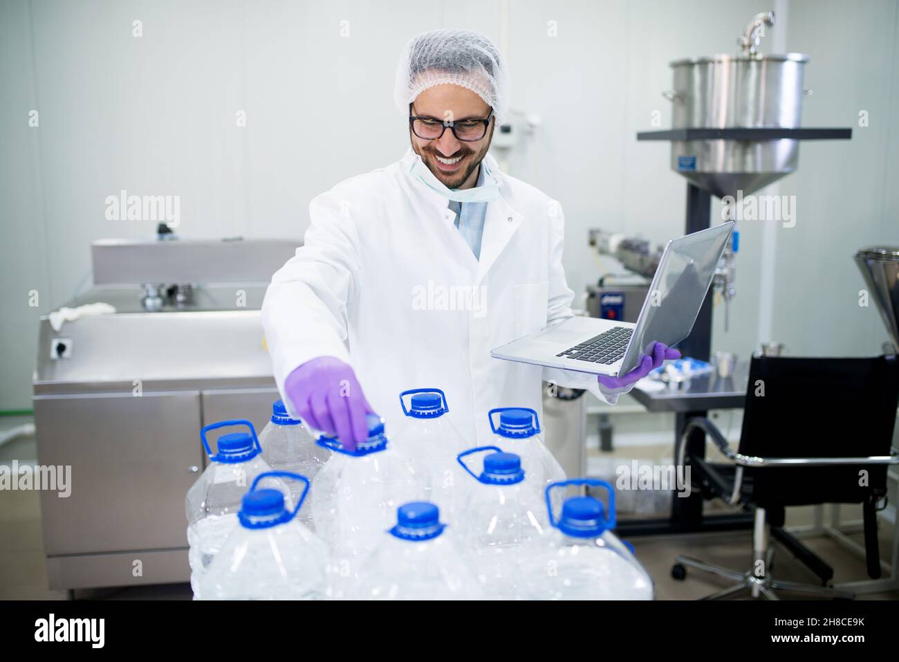 Lab technician doing chemical analysis. Testing chemical composition of ...