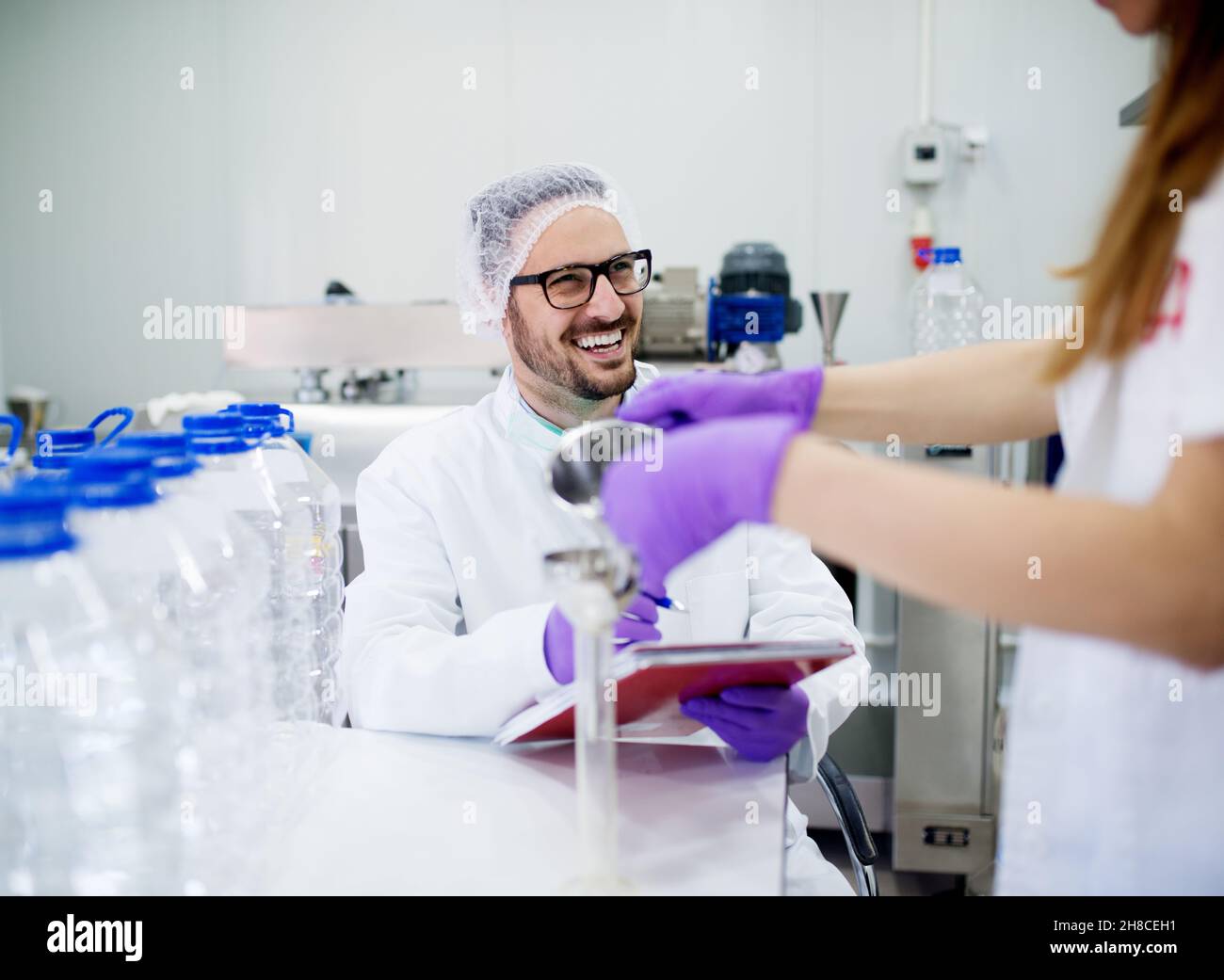 Lab technician doing chemical analysis. Testing chemical composition of ...